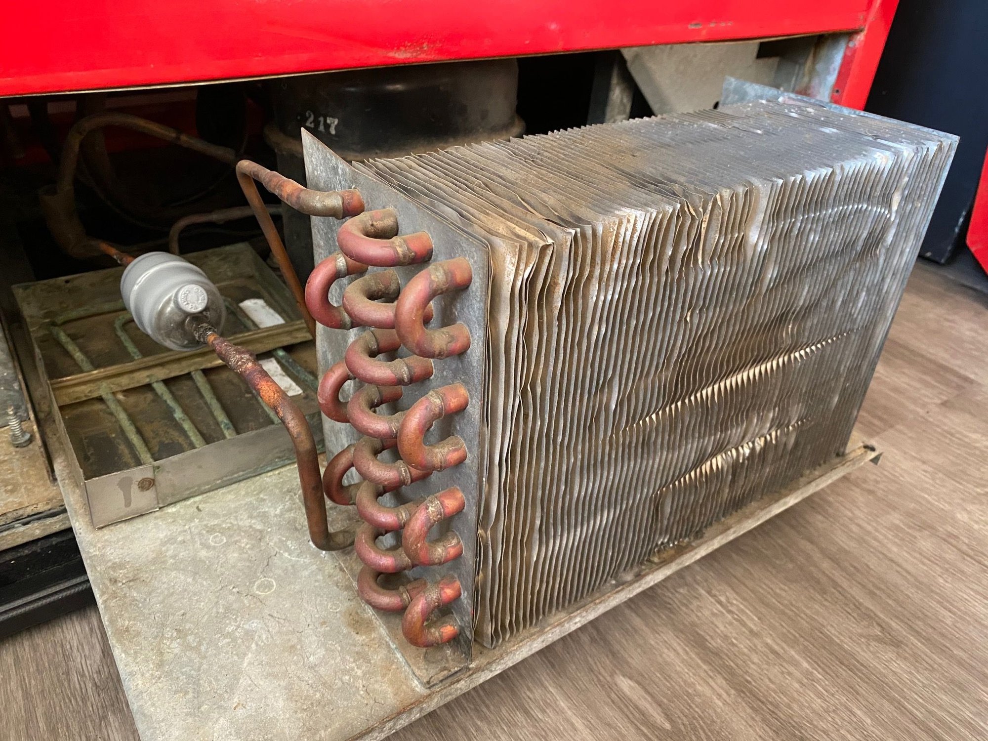 Removal of condensate drain pan from commercial vending refrigerator ...