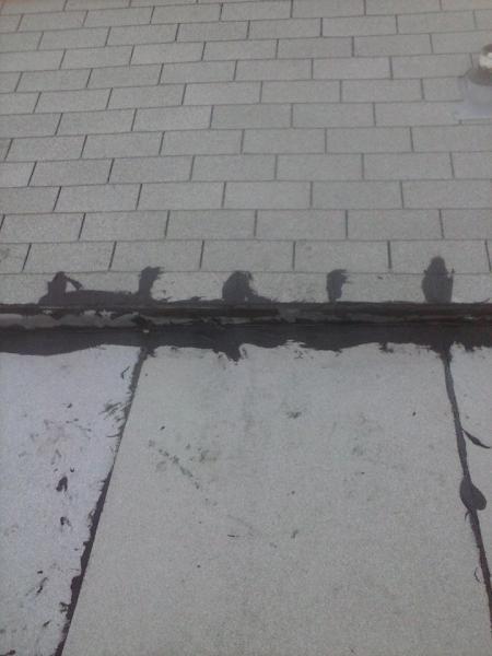 Tieing a cold application tar roof into an existing shingle roof ...