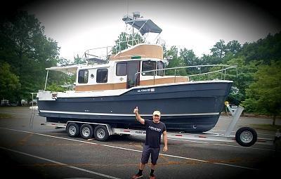 The Hull Truth - Boating and Fishing Forum - Ranger Tug 31CB on a trailer.